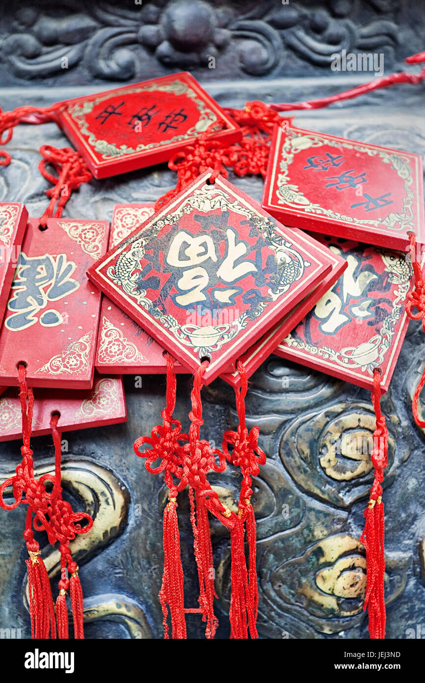 BEIJING-JULY 8. Ornate wishing cards hanging on a copper altar ...