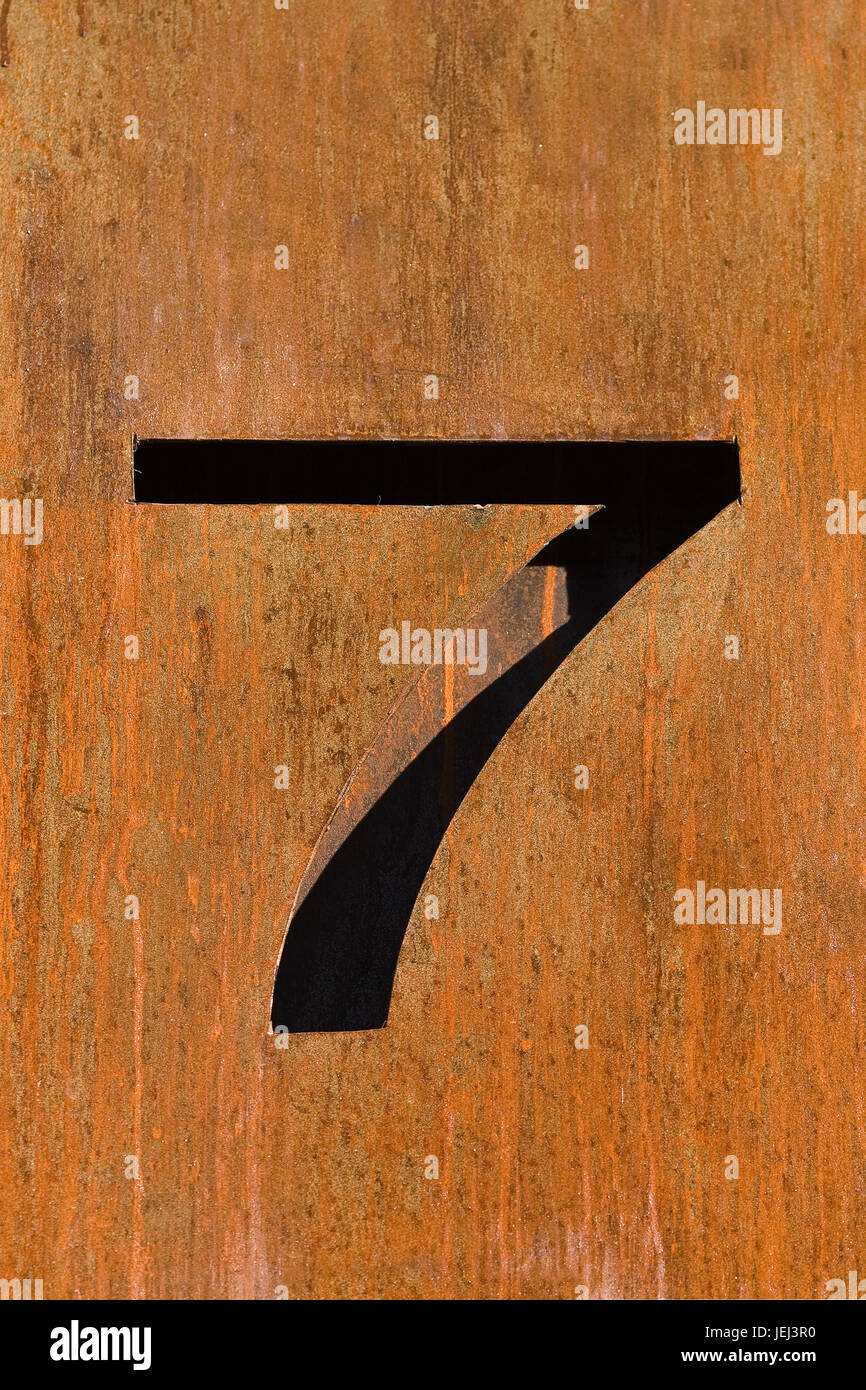 Number seven cut out a rusty metal plate Stock Photo - Alamy