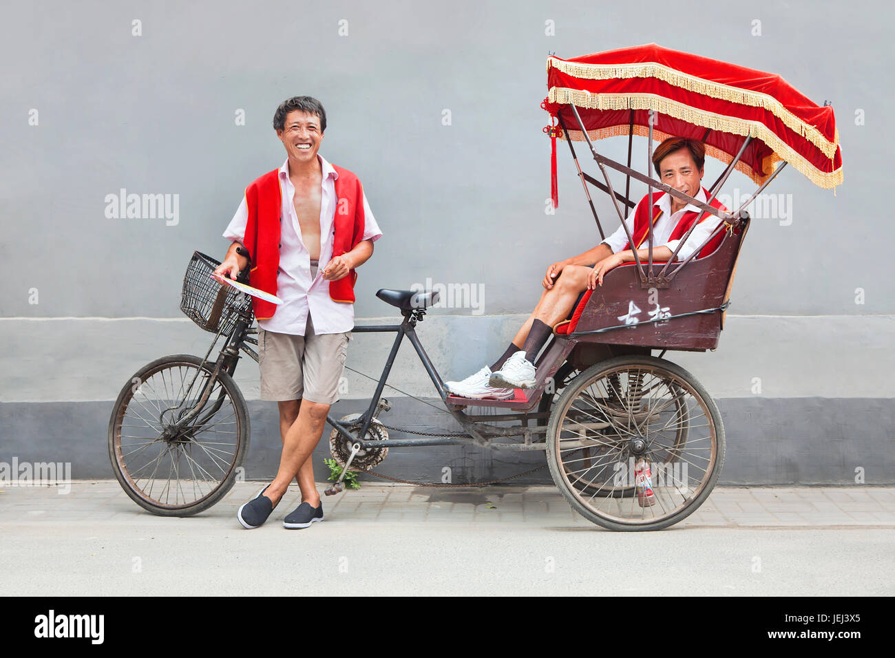 BEIJING–JULY 28. Rickshaw drivers having a break. Rickshaw is the most ...