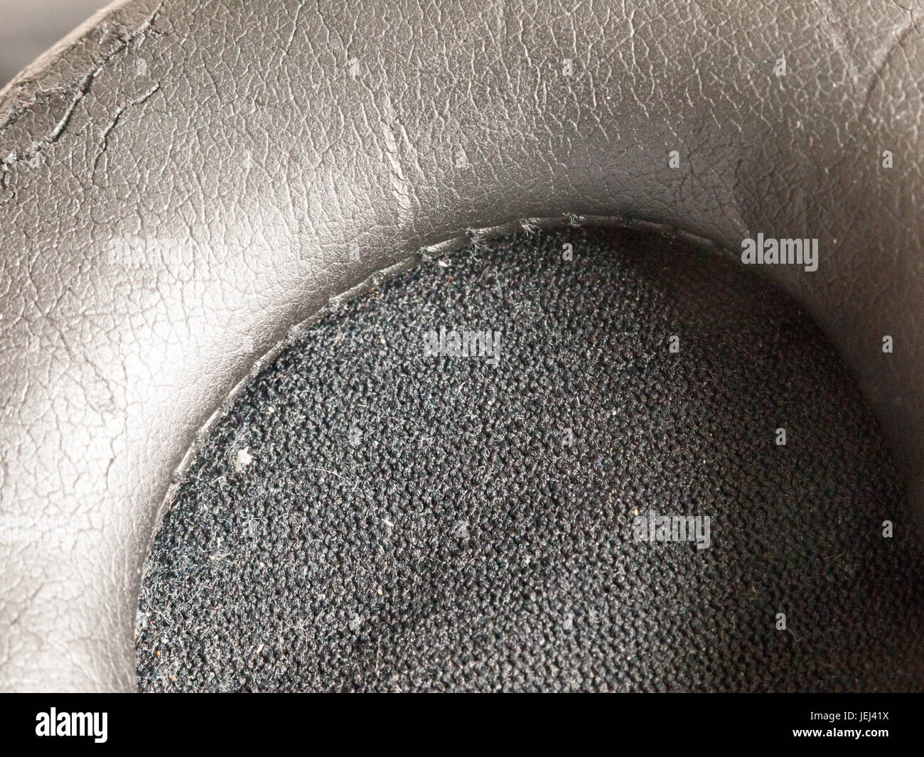 black texture of a headphone earbud up close macro Stock Photo - Alamy