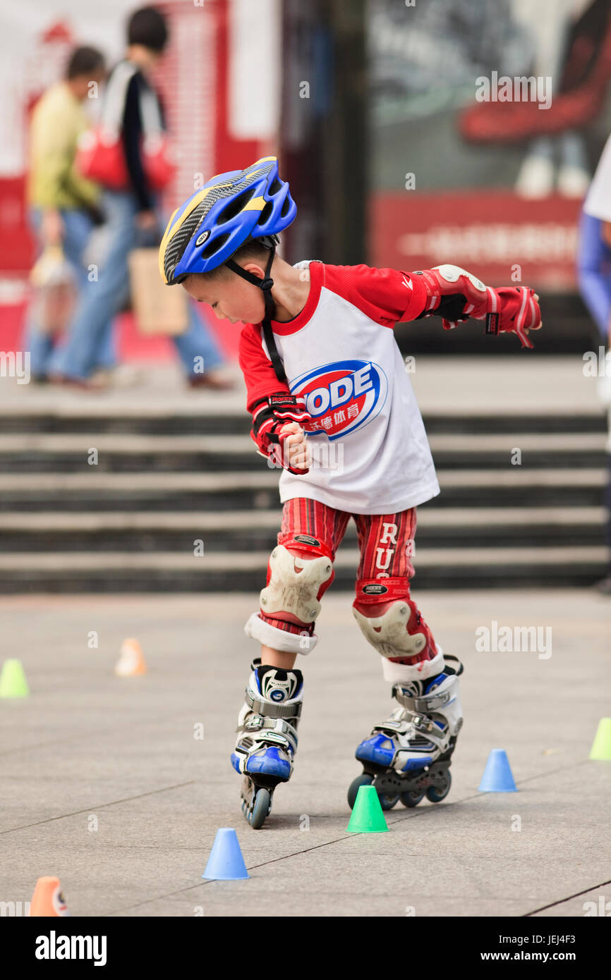 Boy inline skating outdoors hi-res stock photography and images - Alamy