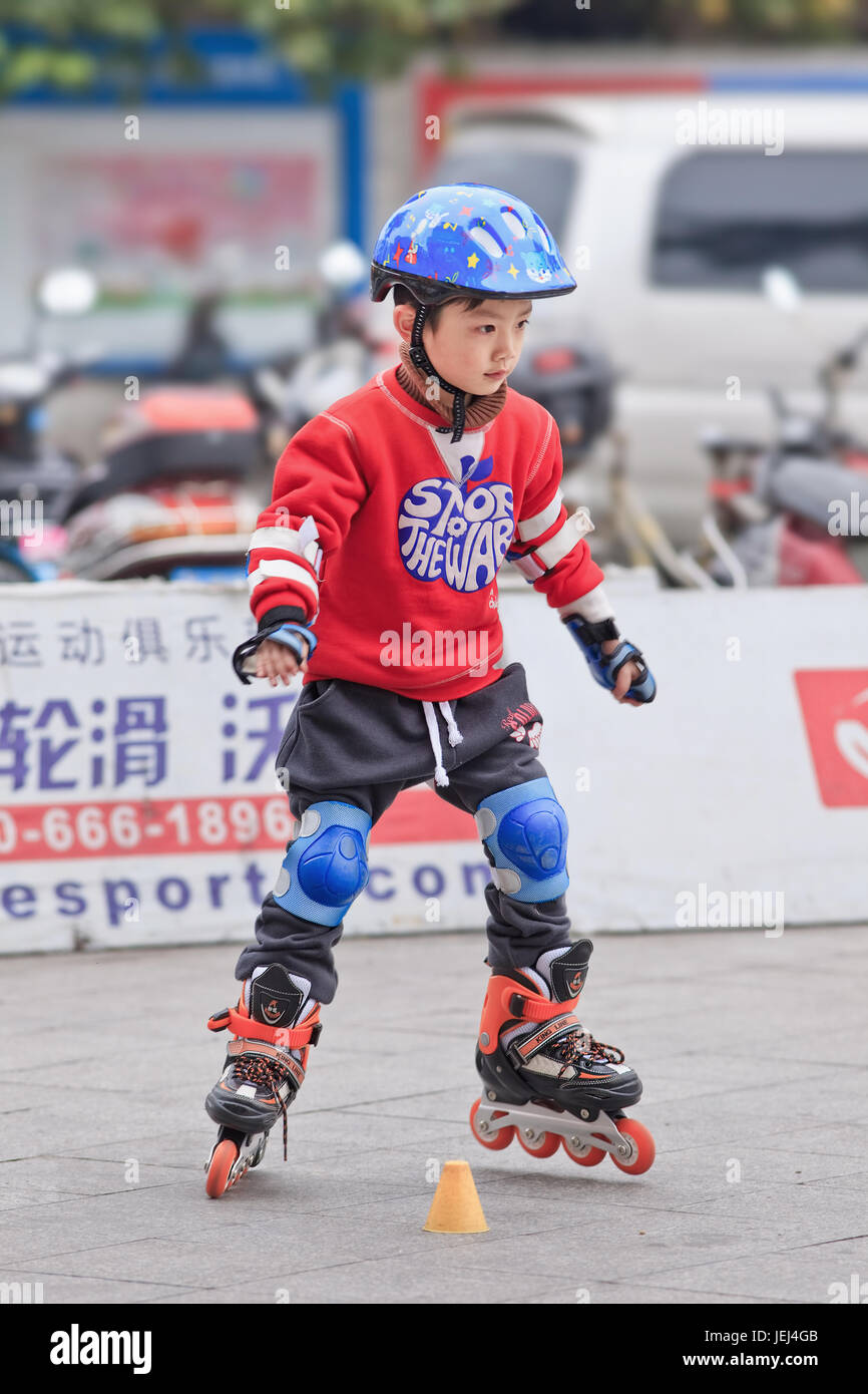 GUANGZHOU-FEB. 26, 2012. Boy practice inline skating. Ping-Pong ...