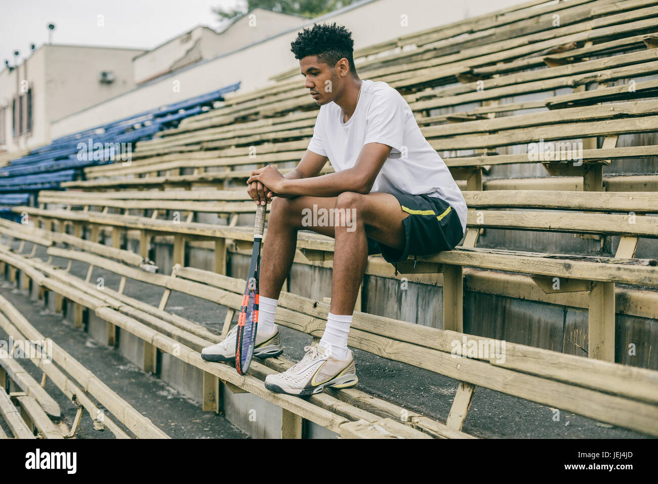 Picture of handsome young man on a bench Stock Photo - Alamy