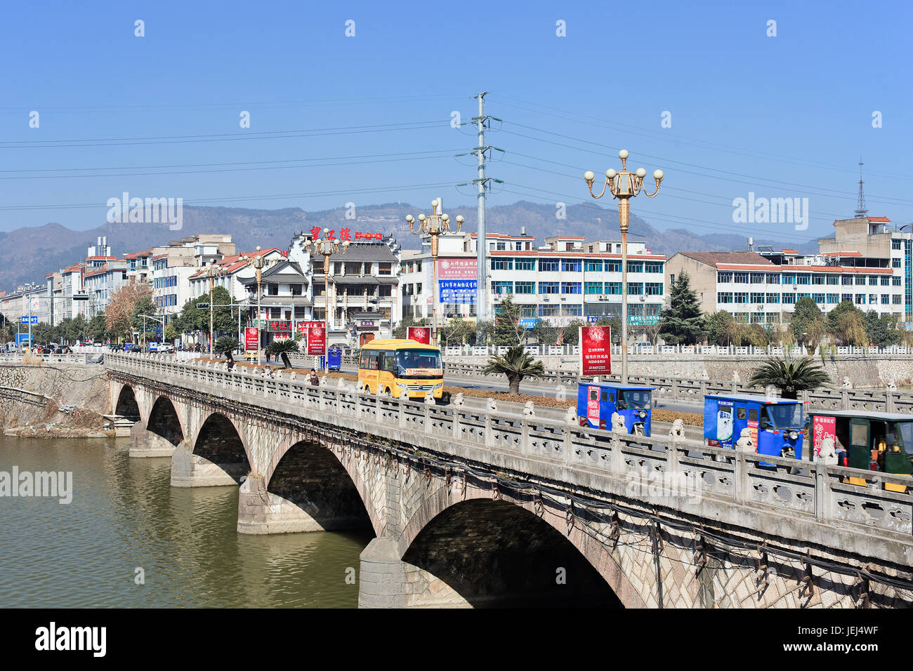 HENGDIAN-JANUARY 1, 2015. Sunlit bridge in Hengdian city center ...