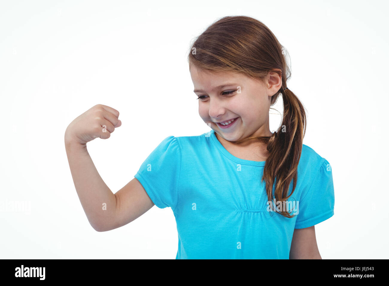 Cute girl showing biceps hi-res stock photography and images - Alamy