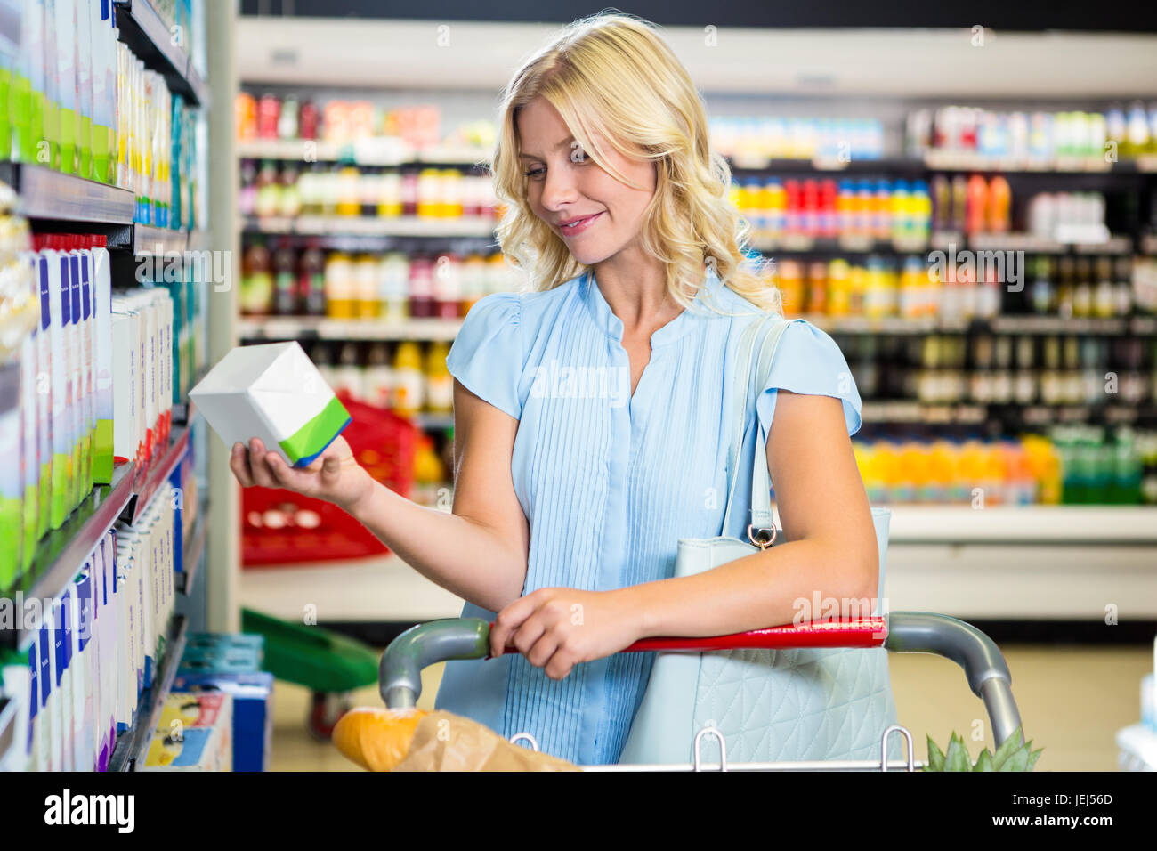 Beautiful woman holding product Stock Photo - Alamy