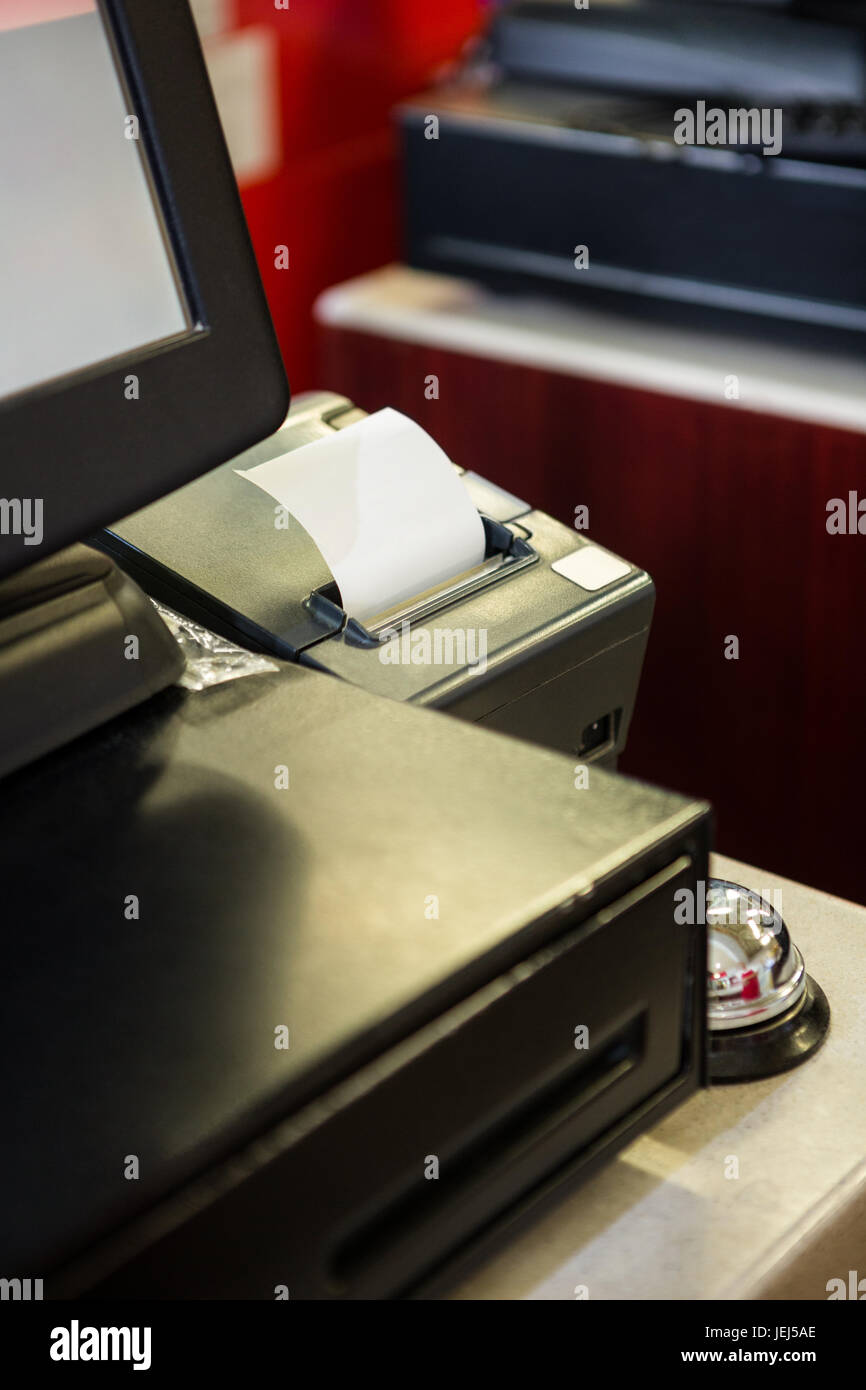Machine printing receipt Stock Photo - Alamy