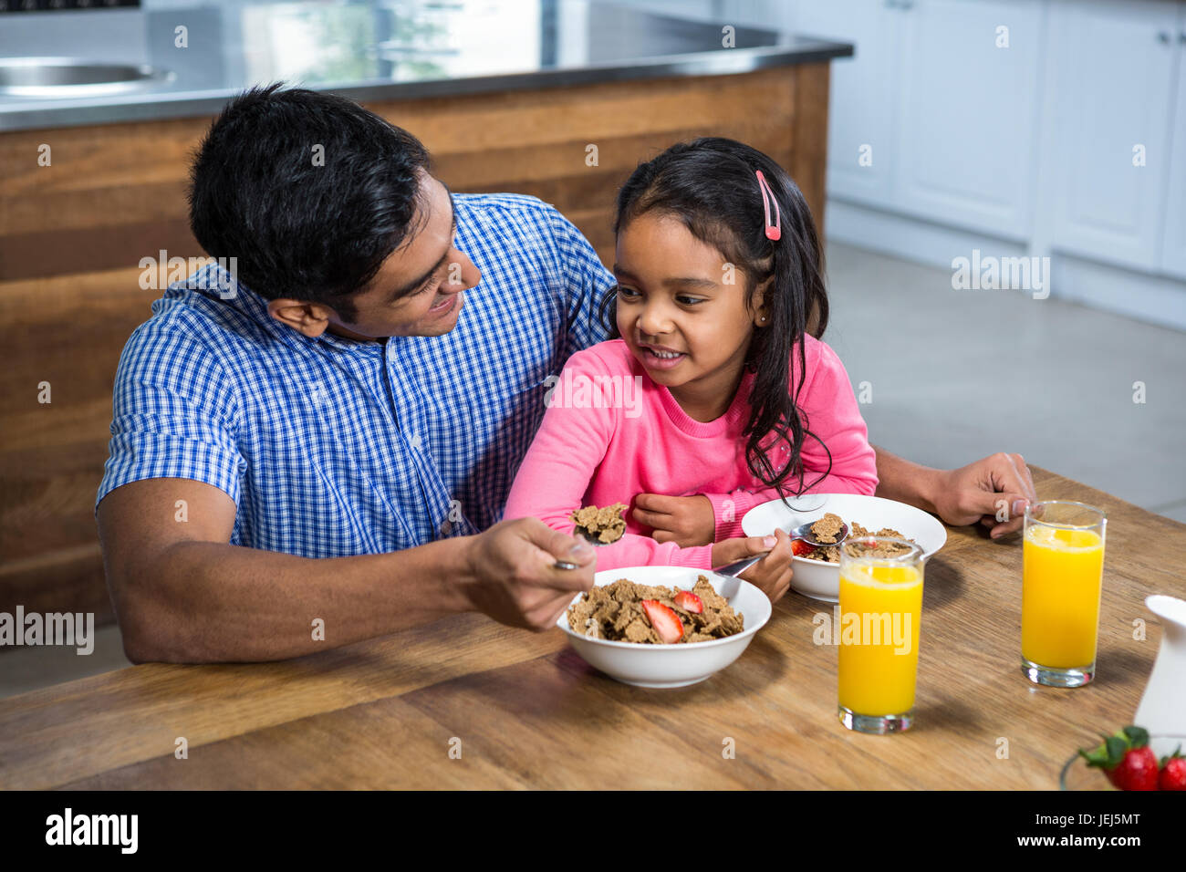 Happy father having breakfast with his daughter Stock Photo - Alamy