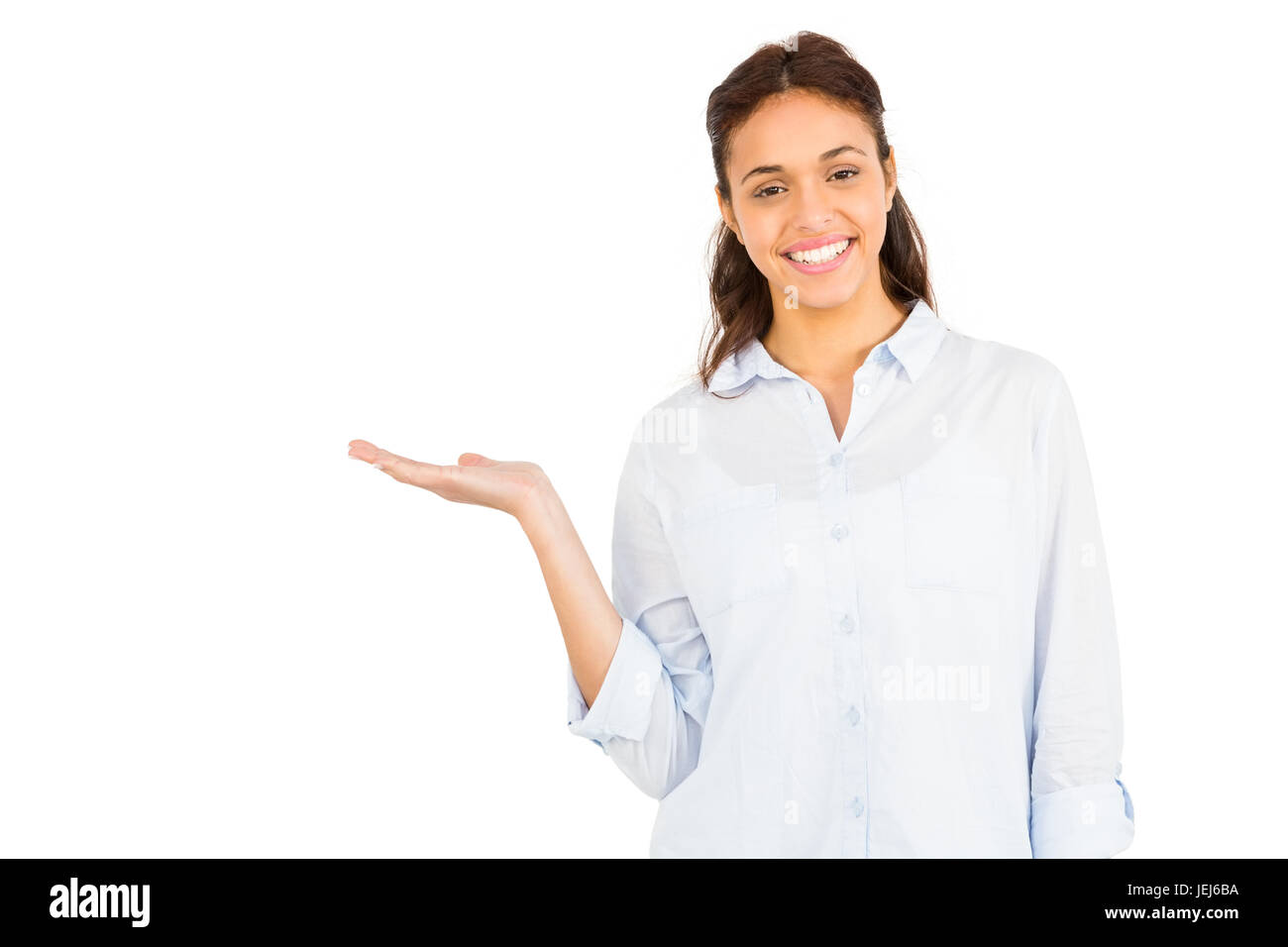 Smiling woman presenting something Stock Photo - Alamy