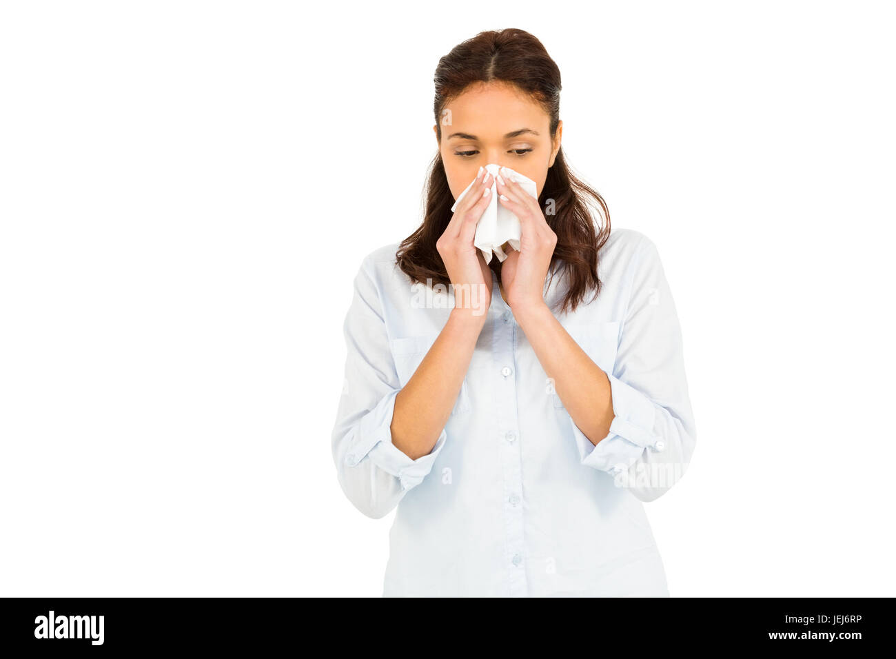 Woman blowing nose with tissue paper Stock Photo - Alamy