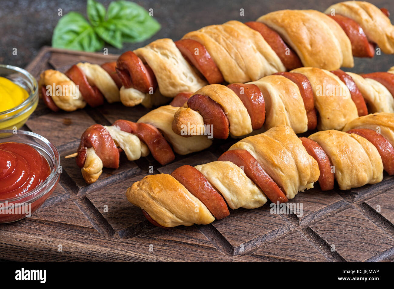 Spiral Cut Tornado Hot Dogs with Ketchup and Yellow Mustard Stock Photo ...