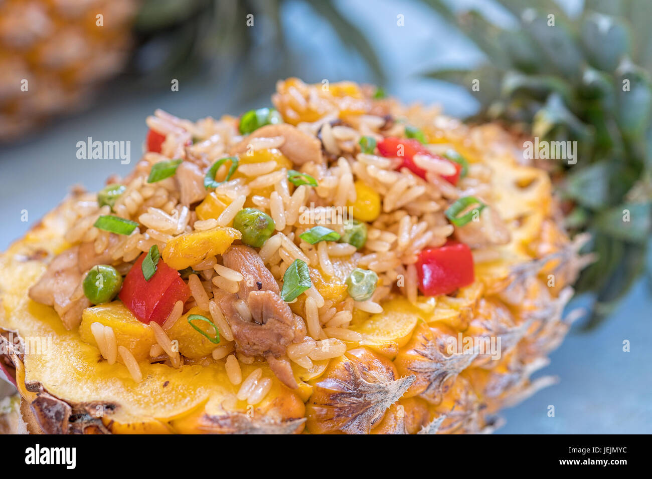 Thai pineapple stuffed with fried rice, chicken and vegetables Stock ...