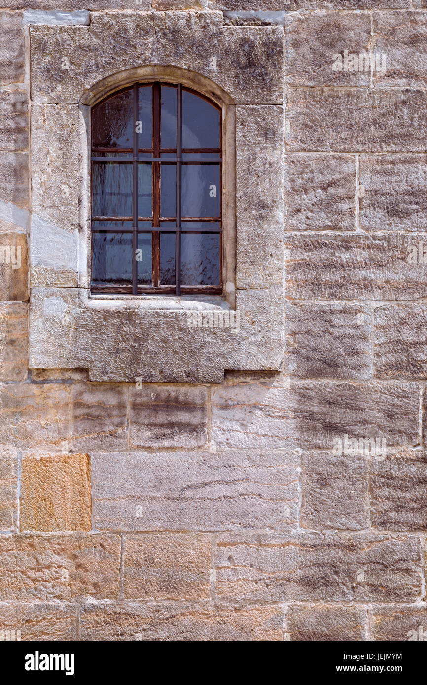 Barred window in stone wall Stock Photo - Alamy