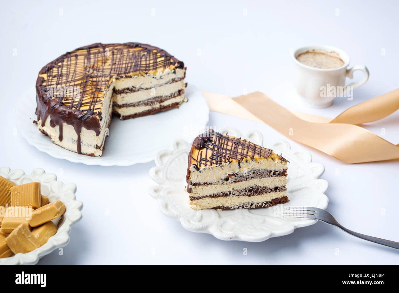 Caramel cake with triangle shaped slice cut out Stock Photo - Alamy