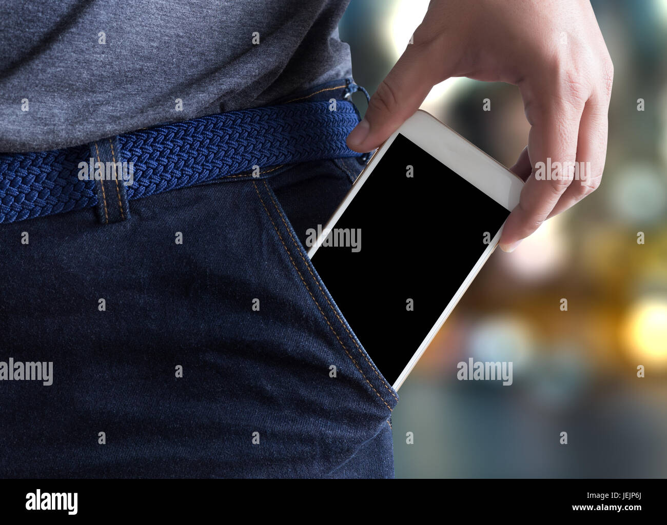 Young handsome poses hand Mobile Phone Pocket Communication Copy Space ...