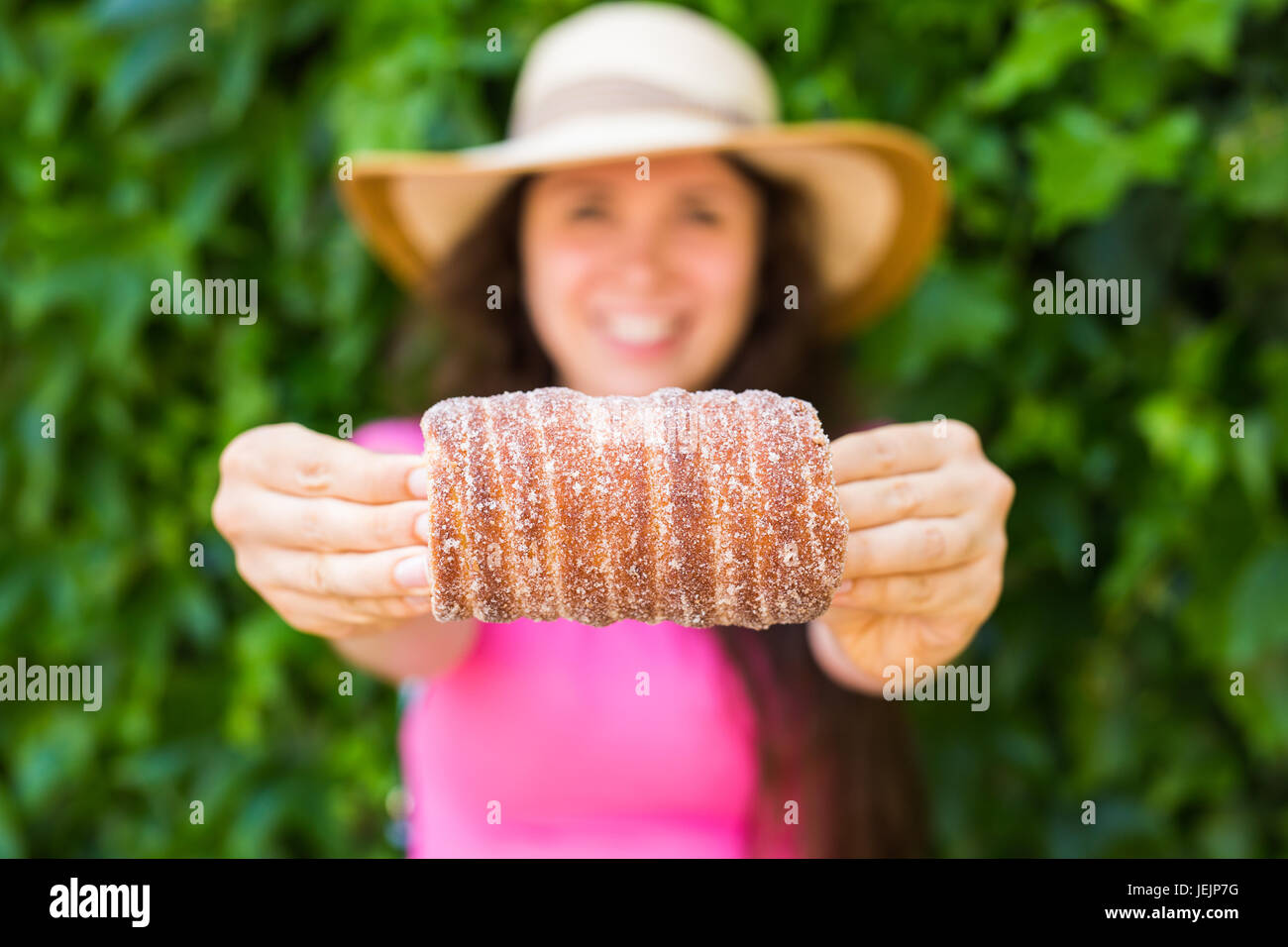 Close Up Of Young Female Tourist With Traditional Czech Dessert