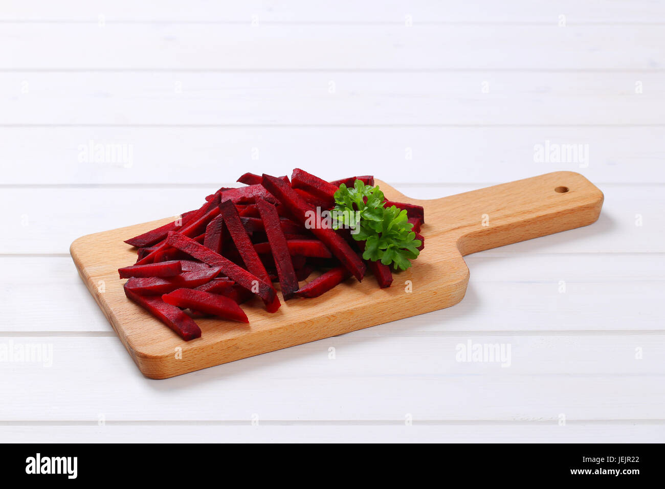 pile of beetroot strips on wooden cutting board Stock Photo - Alamy