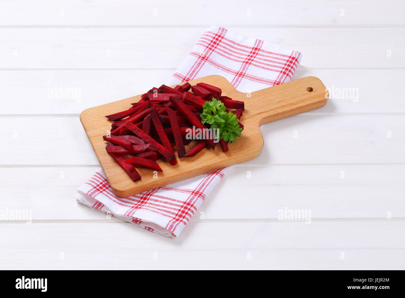 pile of beetroot strips on wooden cutting board Stock Photo - Alamy