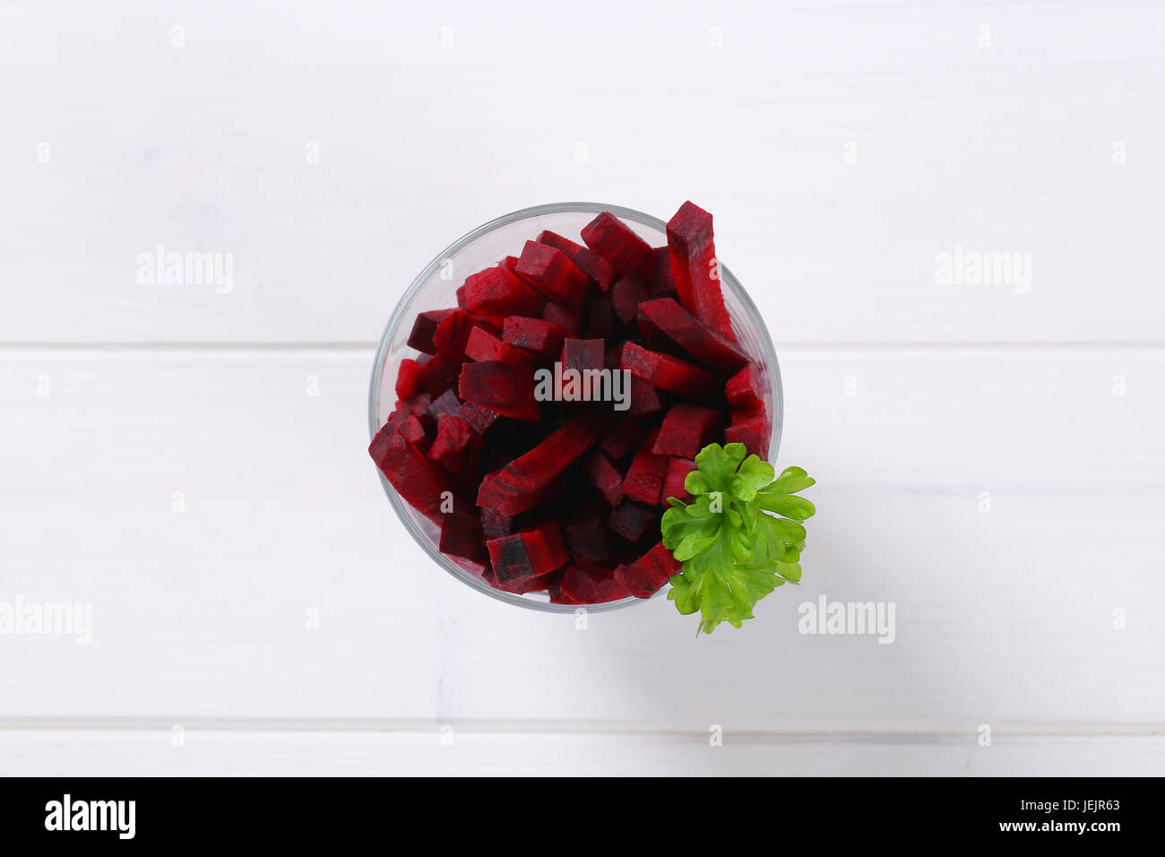 glass of beetroot strips on white wooden background Stock Photo - Alamy