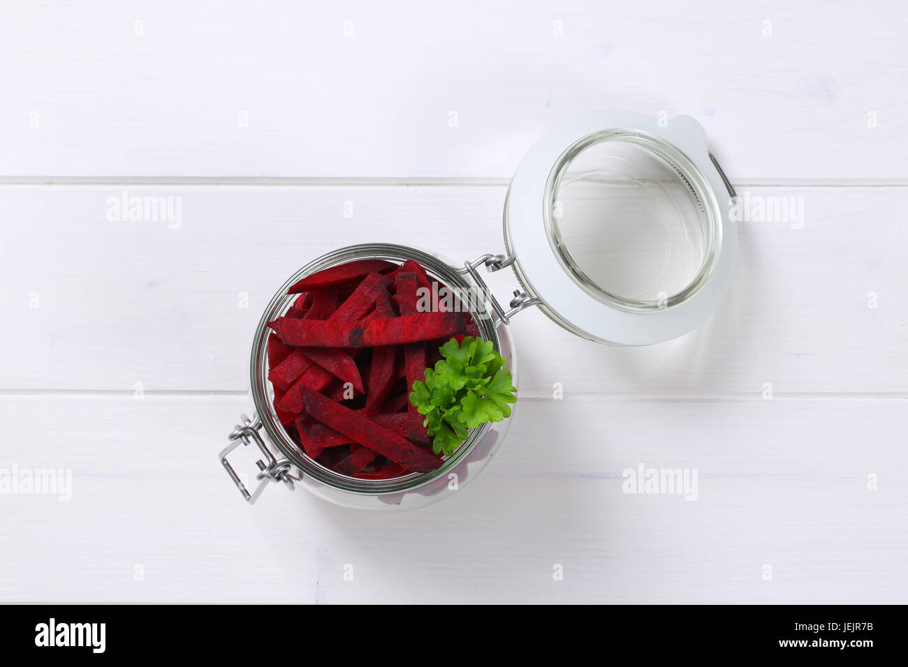 jar of beetroot strips on white wooden background Stock Photo - Alamy