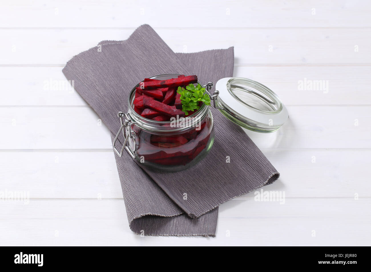 jar of beetroot strips on grey place mat Stock Photo - Alamy