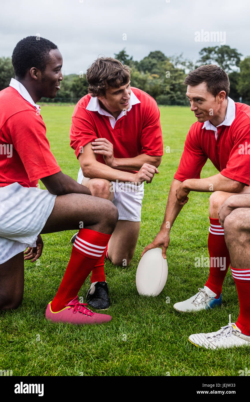 Rugby players discussing tactics before match Stock Photo - Alamy