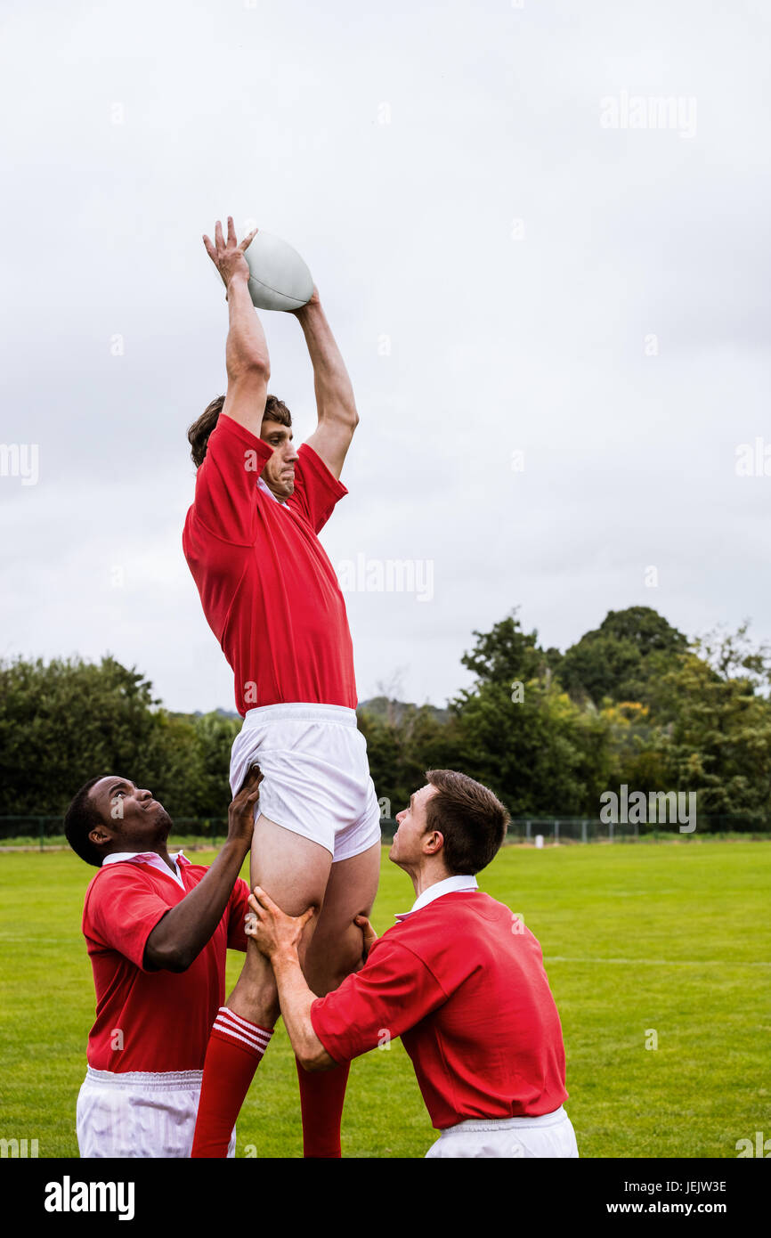 Rugby players jumping for line out Stock Photo - Alamy