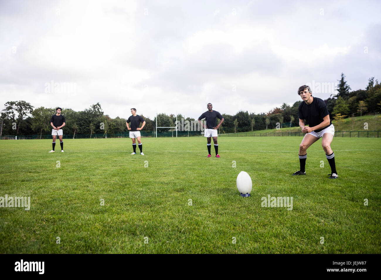 Rugby players training on pitch Stock Photo - Alamy