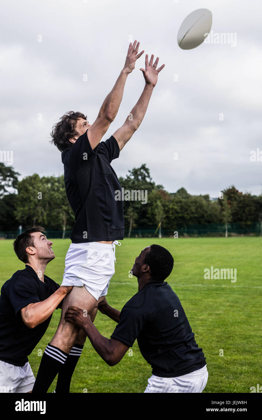 Rugby players jumping for line out Stock Photo - Alamy