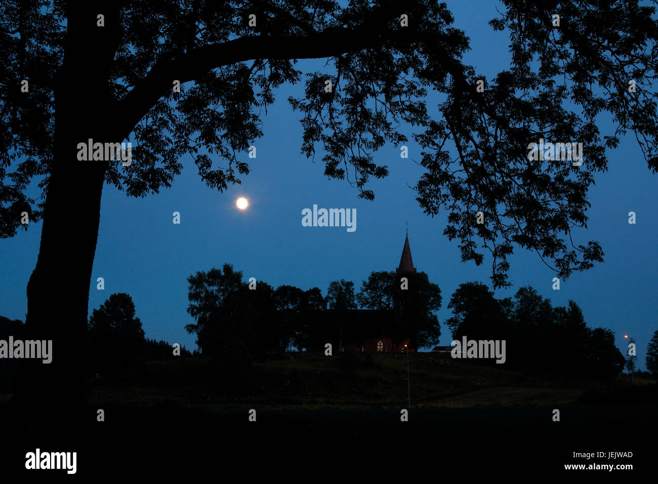 Full moon above church Stock Photo - Alamy