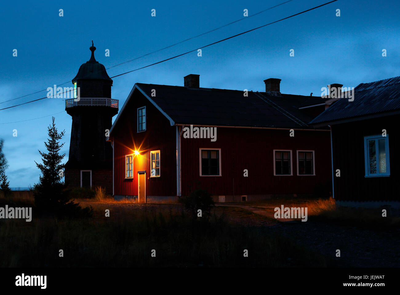 Lighthouse at dusk Stock Photo - Alamy