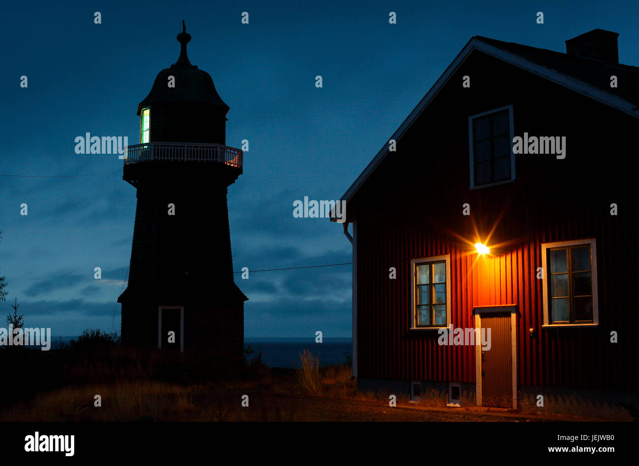 Lighthouse at dusk Stock Photo - Alamy