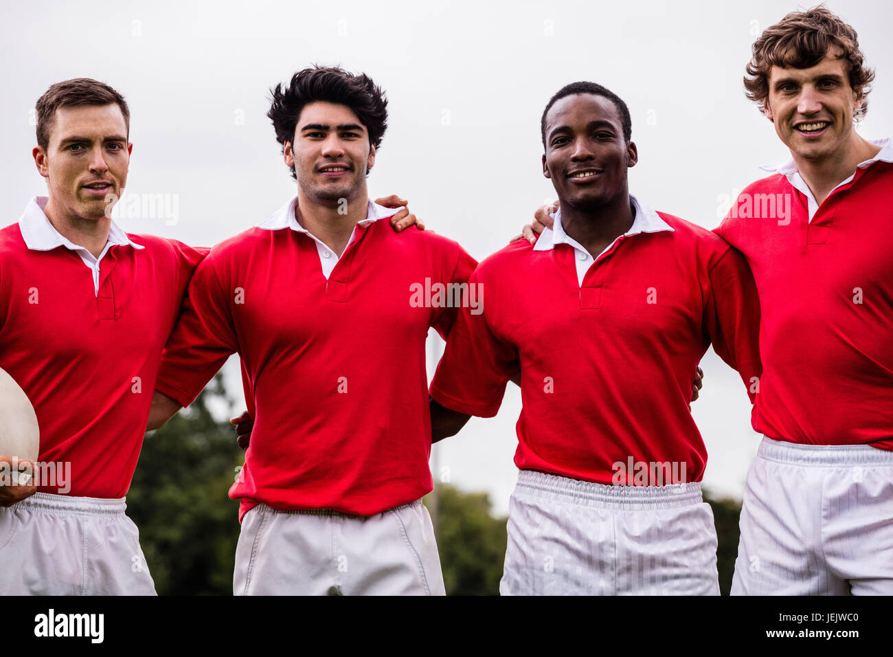 Rugby players smiling at camera Stock Photo - Alamy