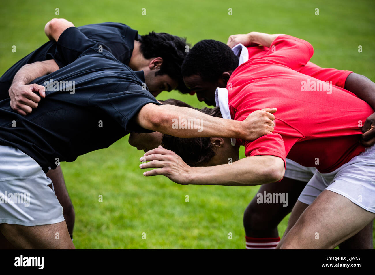 Rugby players doing a scrum Stock Photo - Alamy