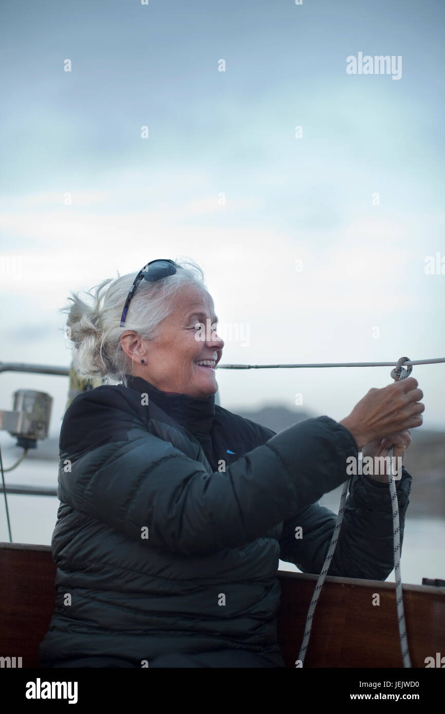 Senior woman on boat Stock Photo - Alamy