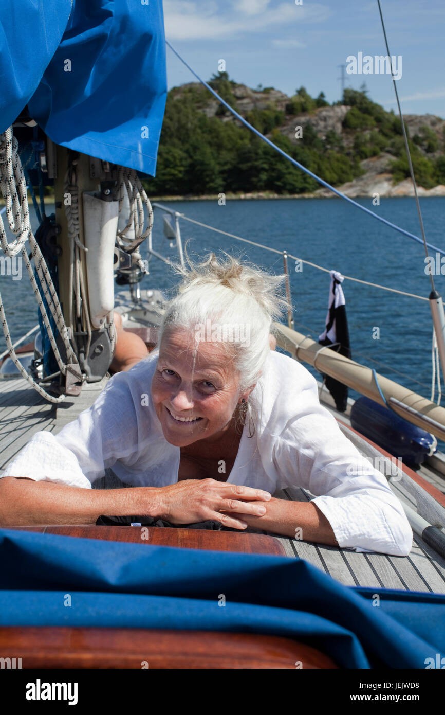Senior woman relaxing on boat Stock Photo - Alamy