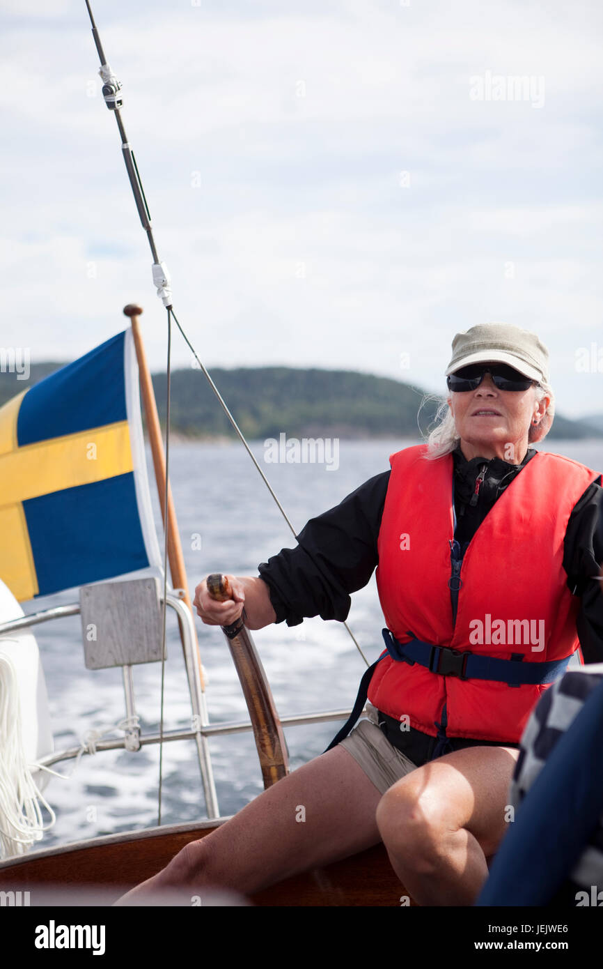 Mature woman on boat Stock Photo - Alamy