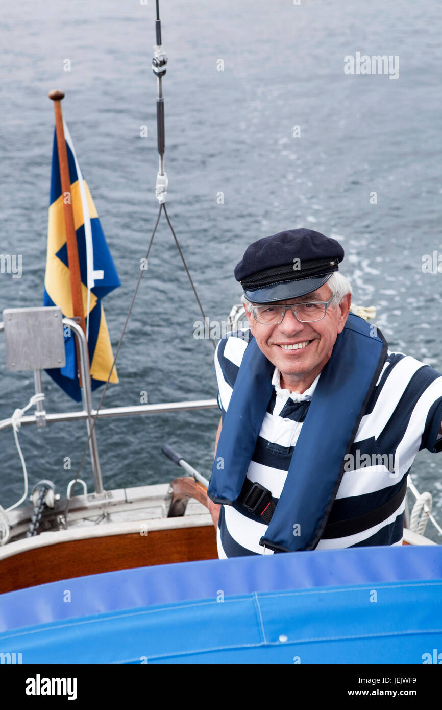 Senior man on boat Stock Photo - Alamy