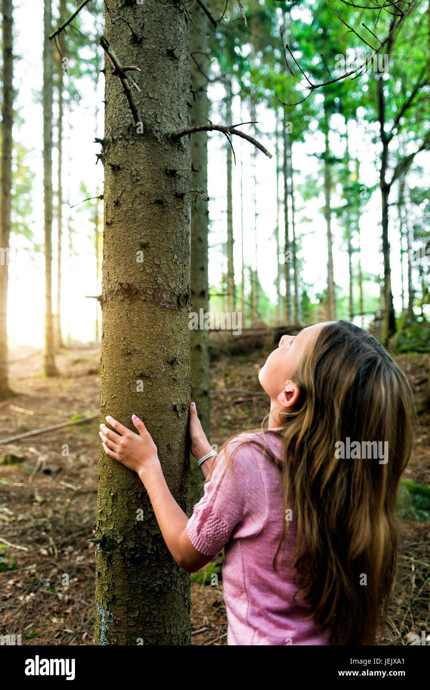 Girl holding tree hi-res stock photography and images - Alamy