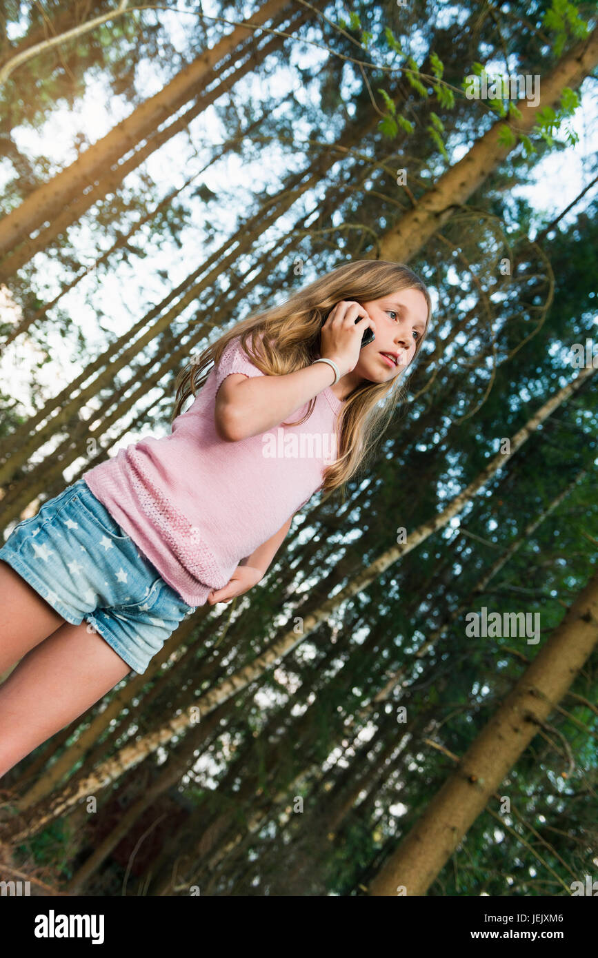 Girl in forest cell hi-res stock photography and images - Alamy