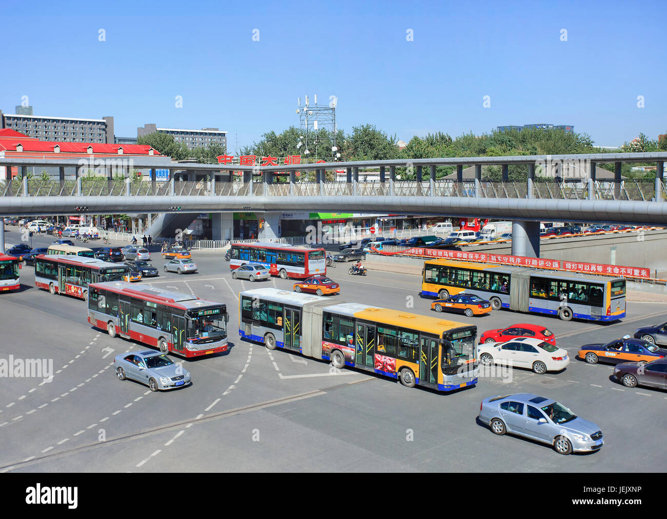 BEIJING-SEPTEMBER 25. Buses and taxis on a busy intersection downtown ...