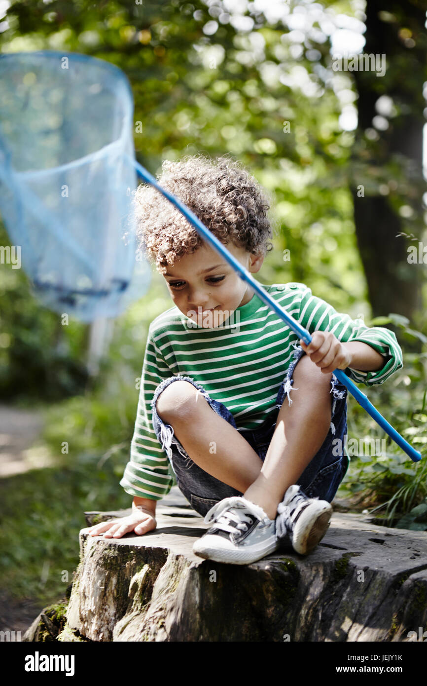 Boy holding net Stock Photo - Alamy