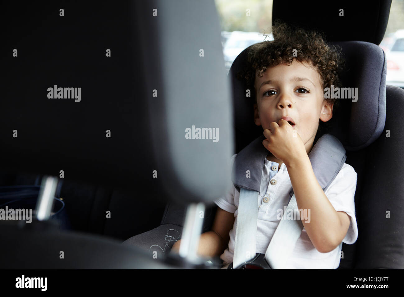 Boy sitting in car Stock Photo - Alamy