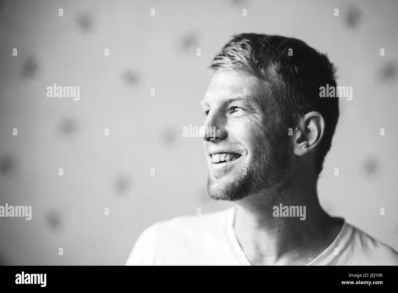 Smiling man looking away Stock Photo - Alamy Smiling man looking away Stock Photo - Alamy
