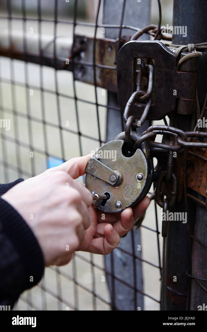 Hands opening padlock Stock Photo - Alamy