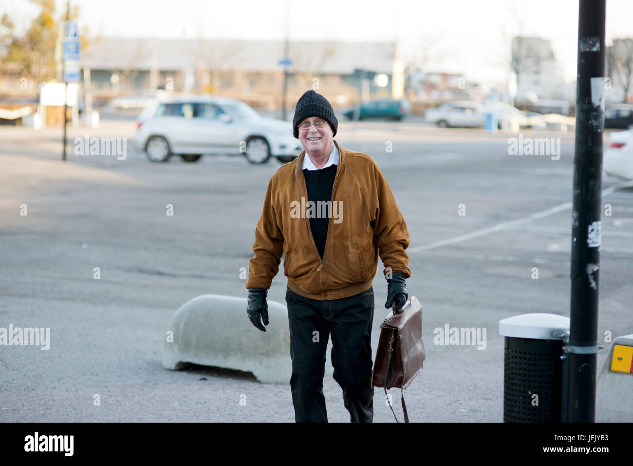 Senior man walking to work Stock Photo - Alamy