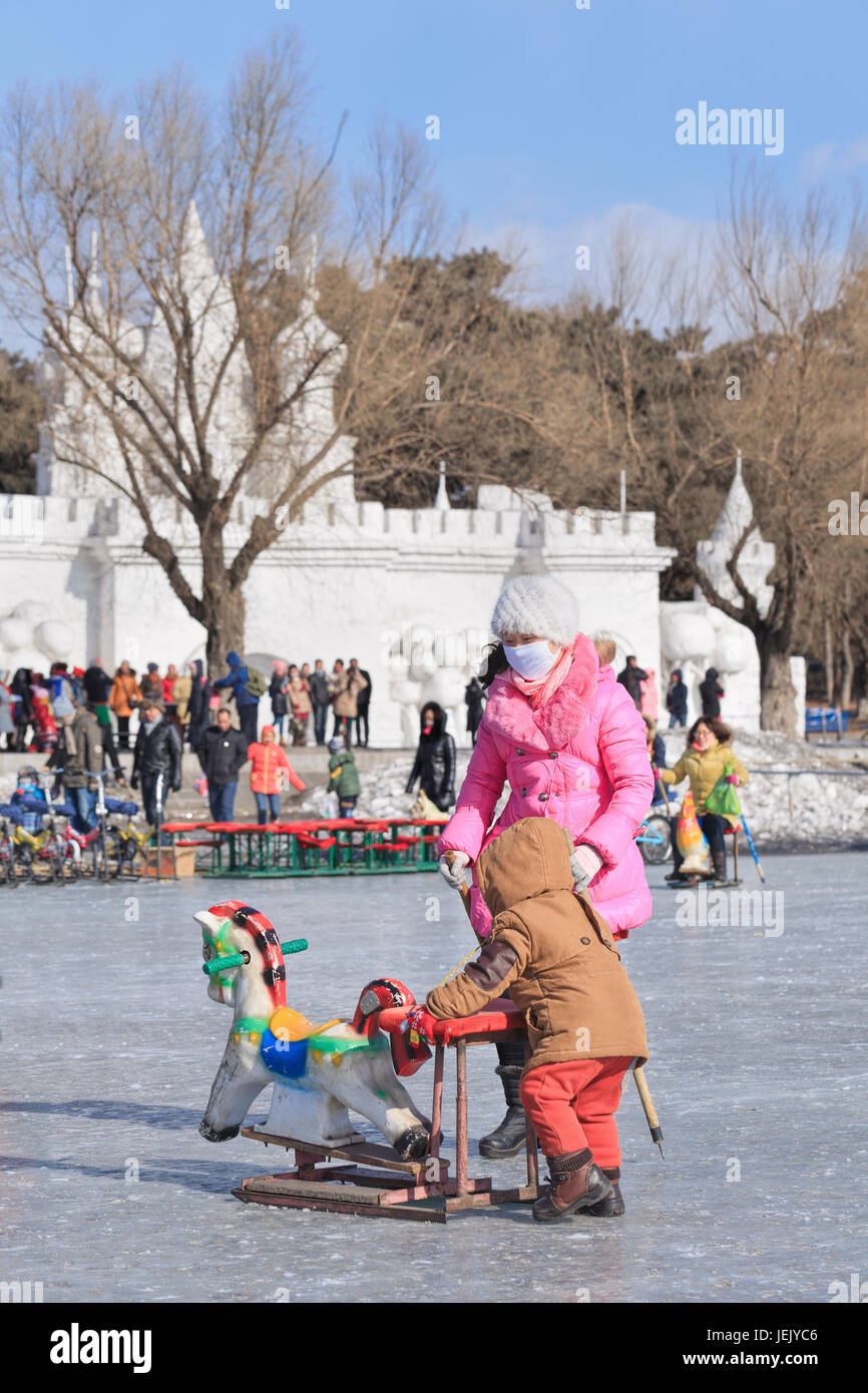 CHANGCHUN – FEBR. 4, 2014. People have fun on the ice in Nanhu Park ...