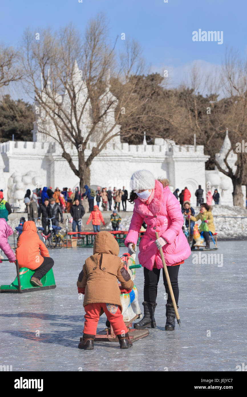 CHANGCHUN – FEBR. 4, 2014. People have fun on the ice in Nanhu Park ...