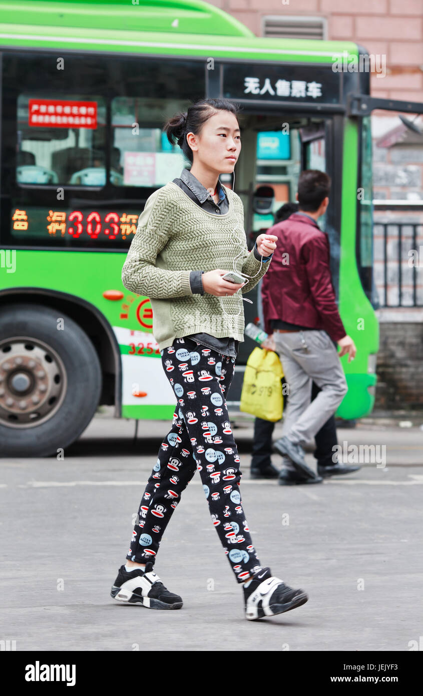 CHONGQING-NOV. 4, 2014. Trendy girl in shopping area. Chinese consumers ...