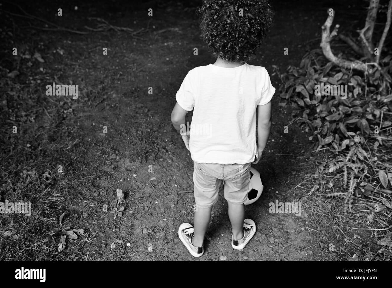 Boy football rear view Black and White Stock Photos & Images - Alamy